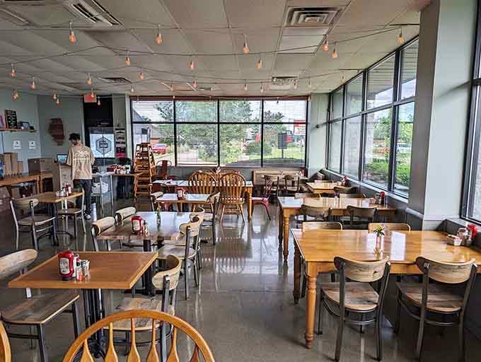 Sunlight floods this modern space where mismatched chairs somehow create perfect harmony and hungry people find breakfast bliss.
