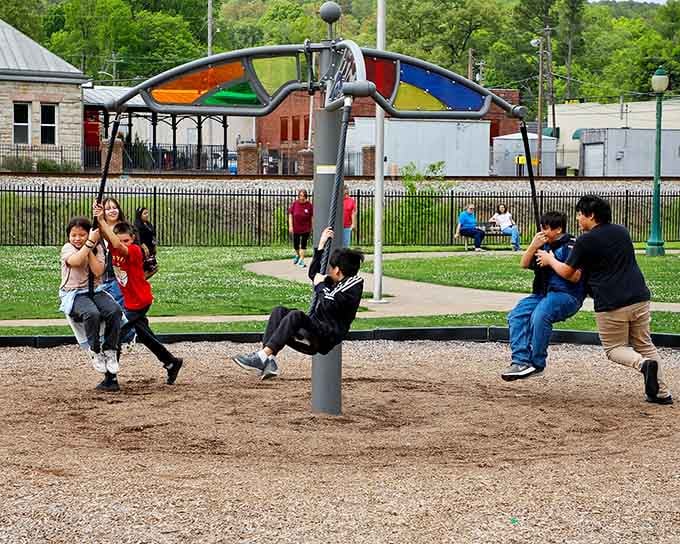 Kids still know how to play outside here, swinging and laughing without a screen in sight. Revolutionary concept, really.