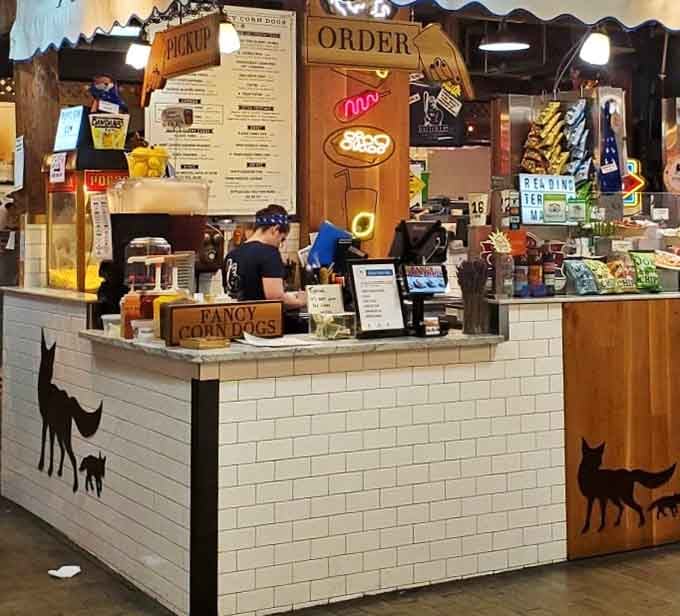 The ordering counter gleams with possibility, where corn dog dreams become delicious reality one batter choice at a time.