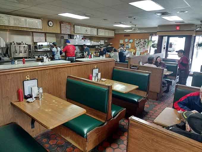 Green vinyl booths and a view of the kitchen: the universal sign that someone's about to feed you well.