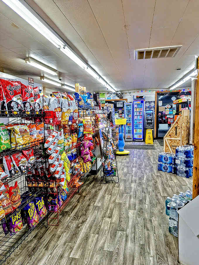 Clean aisles and snack racks disguise the fact that magic happens somewhere behind those chip displays.