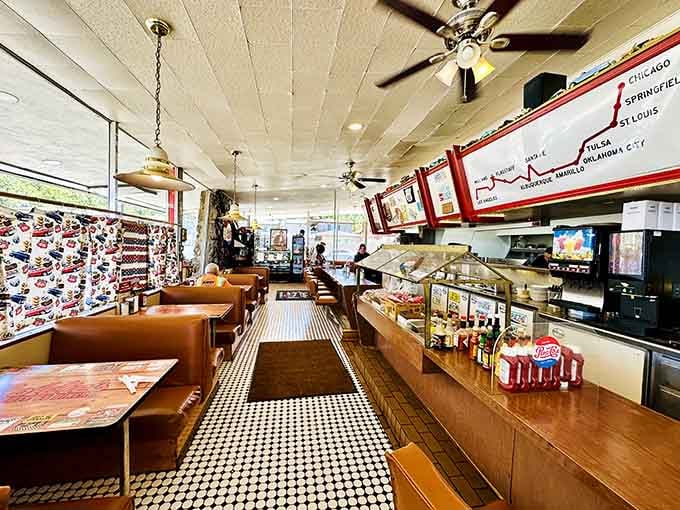 Black-and-white checkered floors and burnt orange booths: the official uniform of American diner perfection.