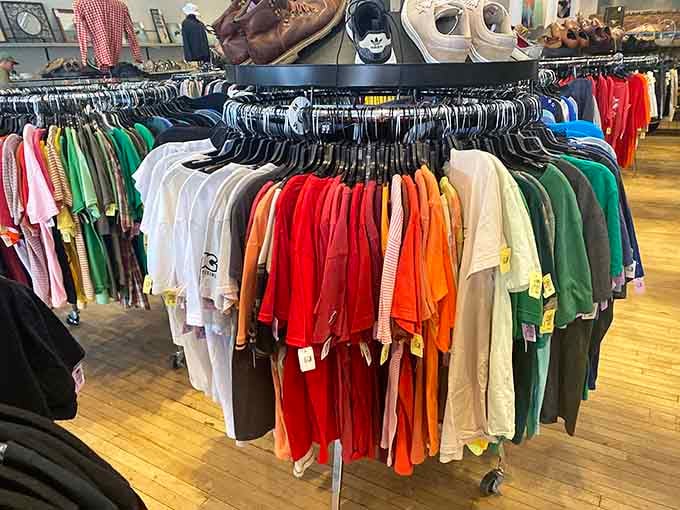Color-coordinated racks stretch endlessly, turning clothes shopping into a rainbow-chasing adventure with unbeatable prices at every turn.