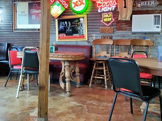 Corrugated metal walls and vintage neon signs create the perfect backdrop for serious comfort food consumption.