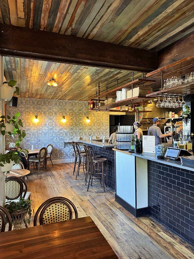 Reclaimed wood ceiling meets vintage tile in this caf&eacute; where every design detail whispers "stay awhile, friend."