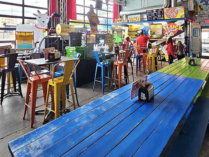 Inside, colorful picnic tables and metal stools create a festival vibe that lasts all year long.