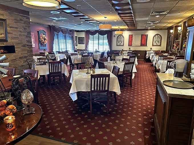 White tablecloths and comfortable chairs set the stage for a meal that might come with unexpected company.
