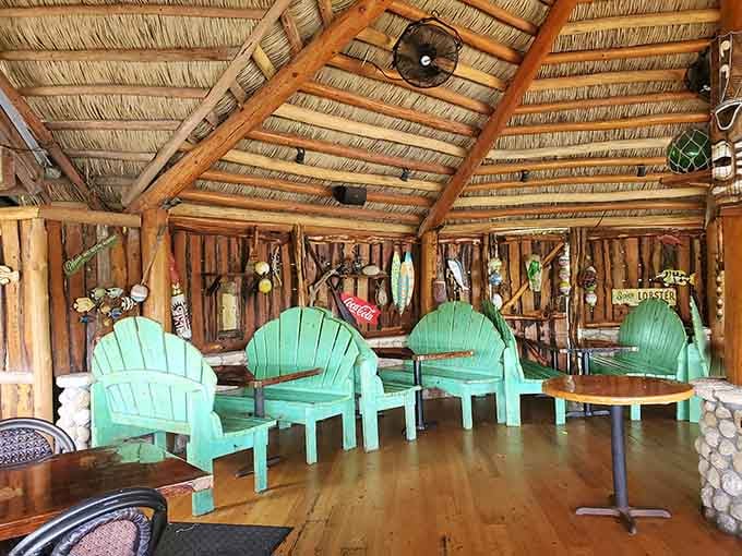 Turquoise Adirondack chairs under thatched roofs where Jimmy Buffett would feel right at home, minus the cheeseburger.