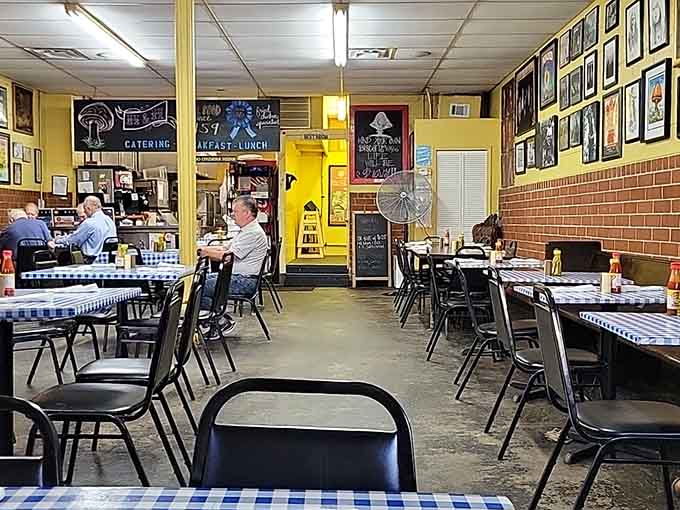 Yellow walls, checkered tablecloths, and enough framed memories to fill a museum dedicated entirely to deliciousness.