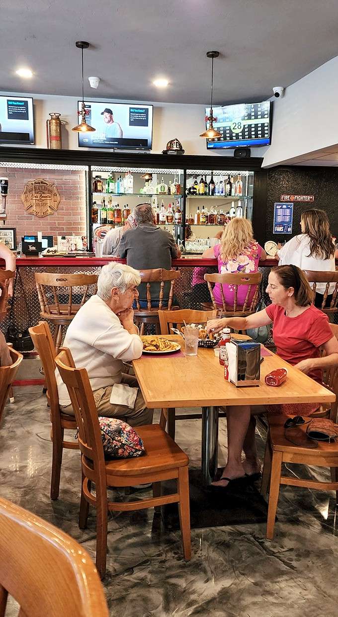 Vintage fire extinguishers and helmets line the walls while families gather for meals that warm the soul.