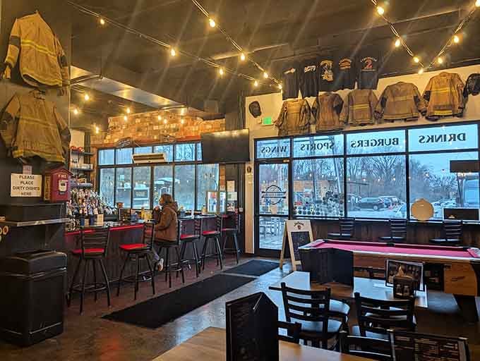 Firefighting gear suspended overhead creates an atmosphere that's part museum, part playground, and entirely unforgettable for everyone.