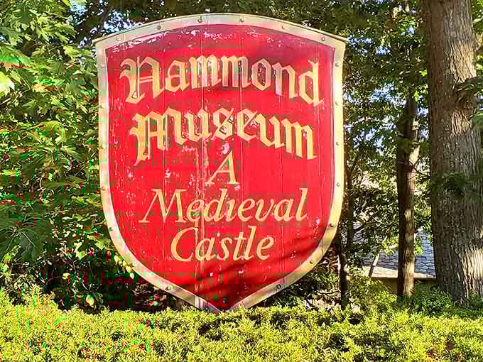 That shield-shaped sign isn't kidding around, this is genuinely a medieval castle in Massachusetts, drawbridge and all.