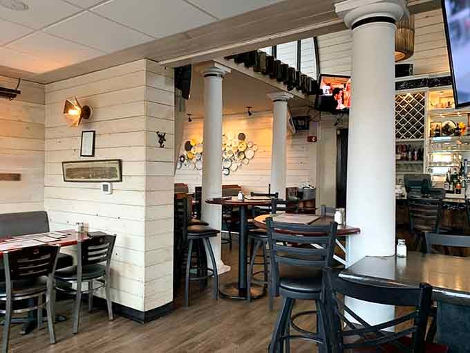 The bright, airy interior with white shiplap walls feels more coastal bistro than traditional tavern vibes.