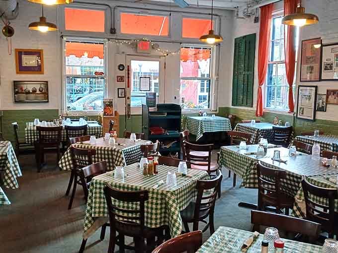 Checkered tablecloths and walls full of memories create an atmosphere that feels like coming home, even your first visit.