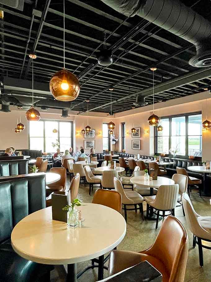 Those globe pendants and plush seating create an atmosphere that whispers "special occasion" without shouting about it.