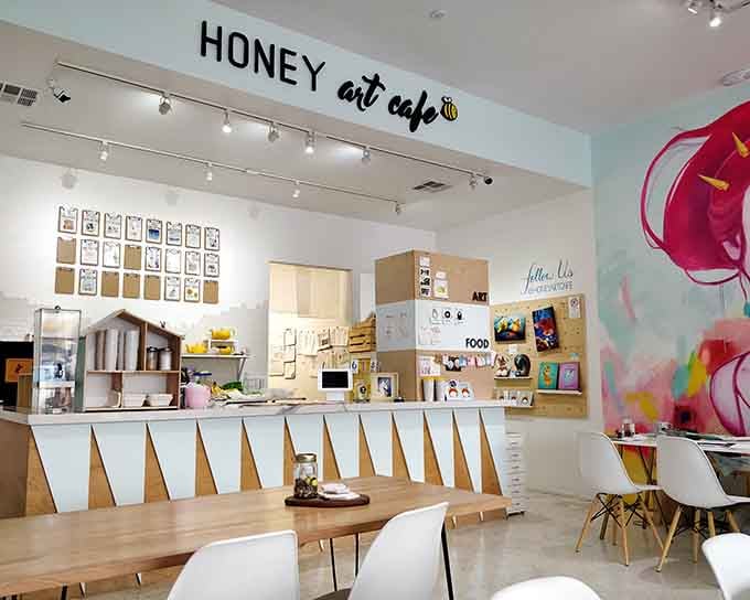 Clean lines and geometric light fixtures create a modern sanctuary where creativity flows as freely as coffee.