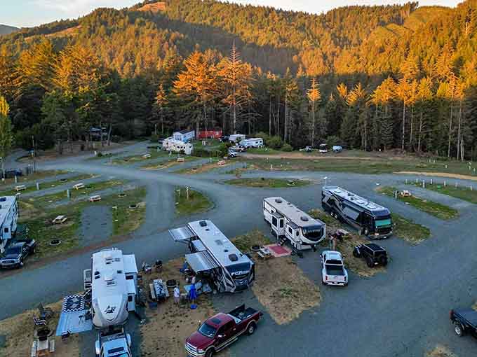 RVs nestled among the trees with mountains watching over them&mdash;this is camping done right, folks.