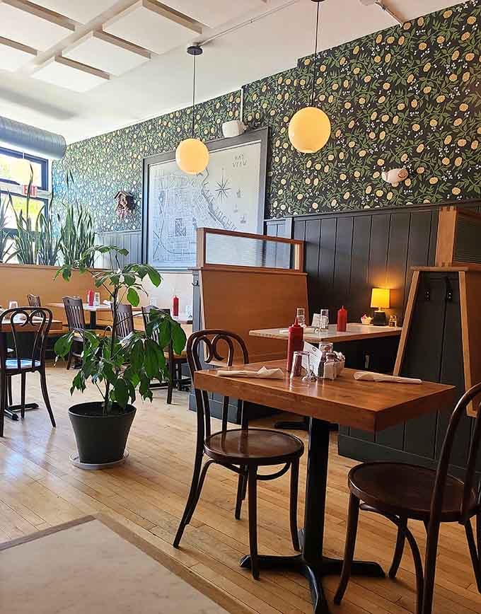 Retro wallpaper and globe pendants create that "visiting your stylish aunt in 1962" vibe we all secretly crave.