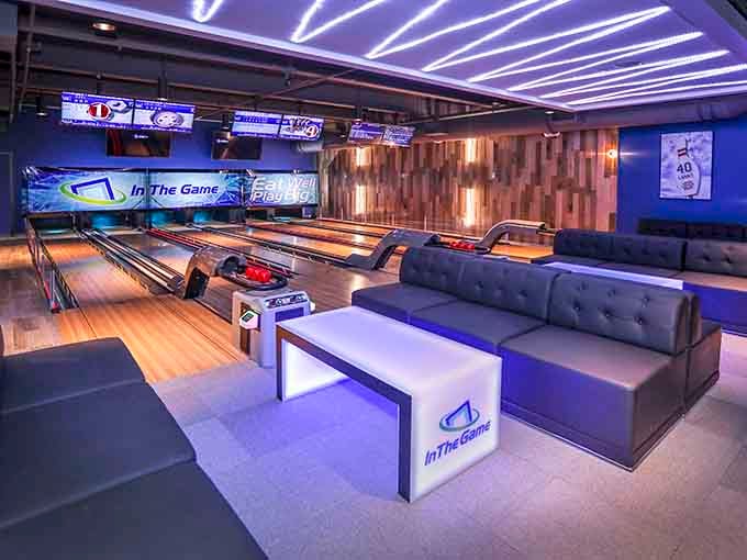 Bowling lanes meet nightclub vibes with plush seating that beats folding chairs any day of the week.