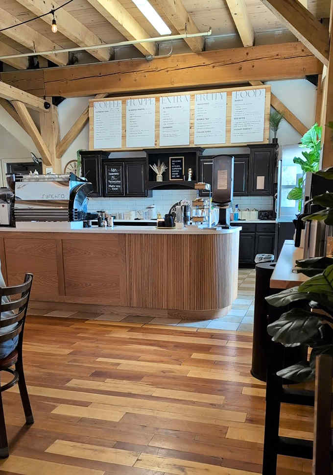 Clean lines, warm wood, and those cheerful red chairs create the perfect pretzel-eating sanctuary you didn't know you needed.