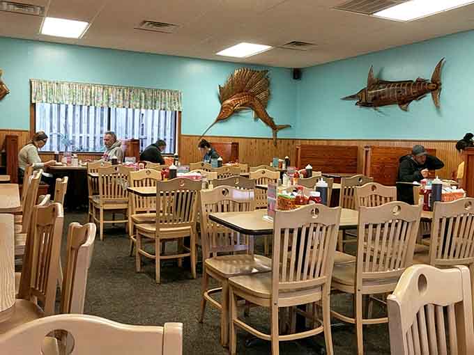 Inside, wooden fish watch over diners like breakfast guardians, ensuring every pancake gets the respect it deserves.