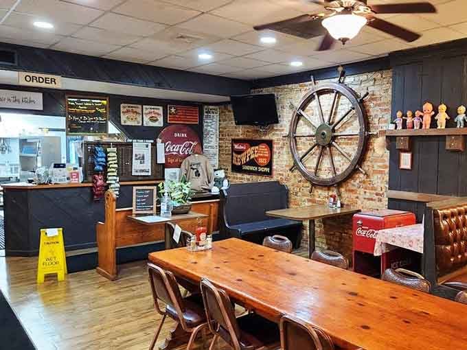 Vintage Coca-Cola signs, wagon wheels, and worn-in booths create a time capsule you can actually eat in and enjoy.