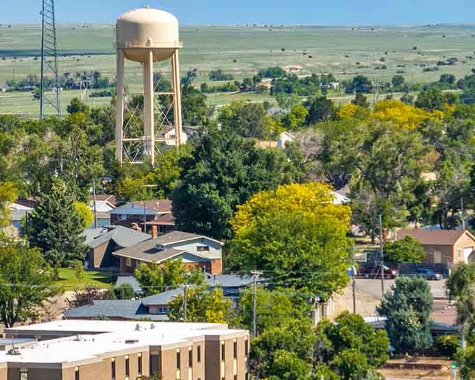 Tree-lined neighborhoods stretch across the valley where your retirement savings can actually buy something substantial.