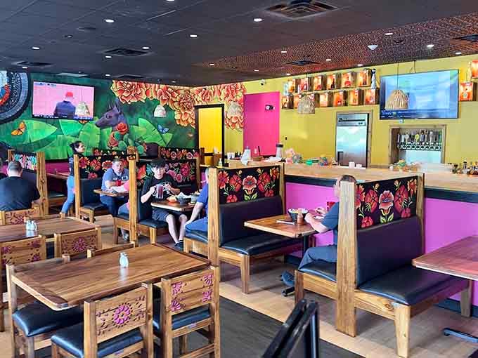 Bold colors and hand-painted booths create an atmosphere that's equal parts festive celebration and comfortable dining room.