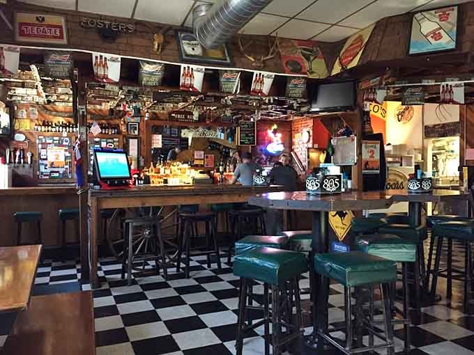 The checkered floor and cozy bar setup whisper "stay awhile," and honestly, you'll want to take that advice.