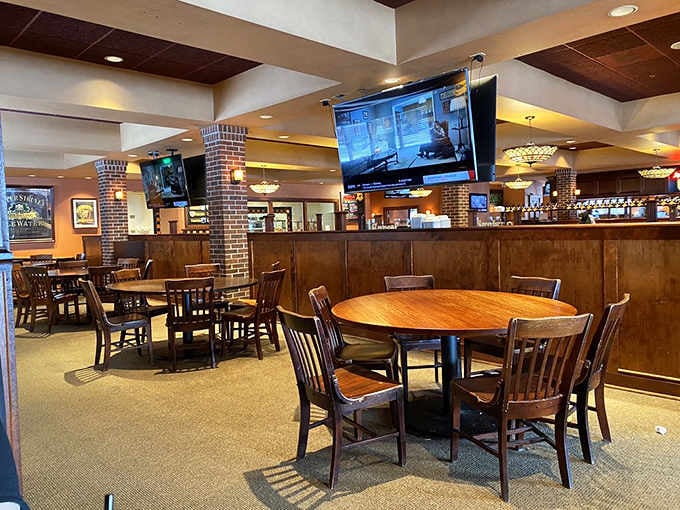 Wood tones, TVs for the game, and round tables perfect for sharing stories over seriously good food.