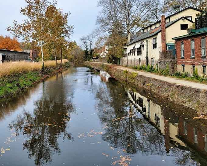 The Delaware and Raritan Canal reflects autumn leaves like nature's own mirror, perfect for contemplative strolls and deep thoughts.