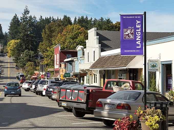 The purple "Village by the Sea" sign welcomes you to a place where stress goes to retire.