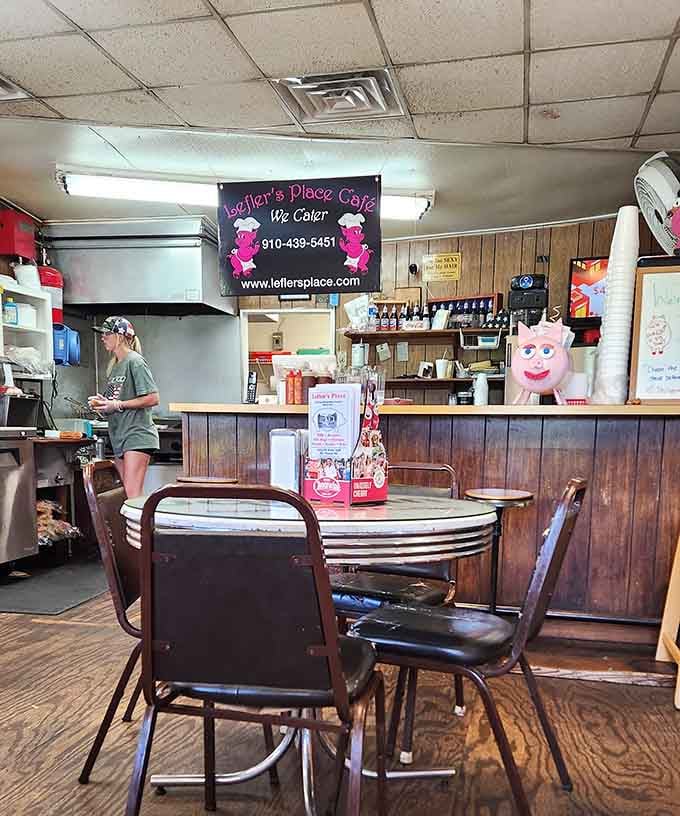 Wood paneling and simple tables create the kind of comfortable atmosphere where strangers become friends over burgers.