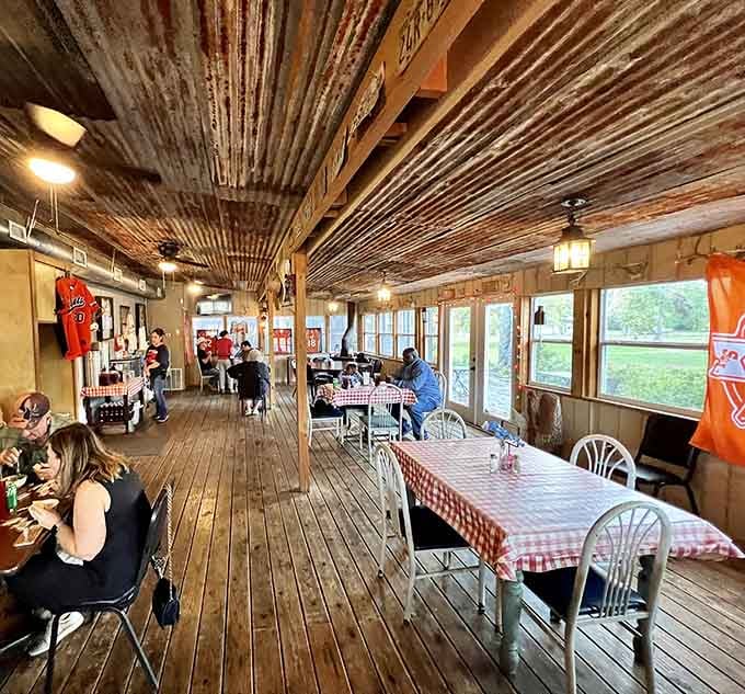 Corrugated metal ceilings and checkered tablecloths create an atmosphere where exceptional food meets unpretentious charm in perfect harmony.