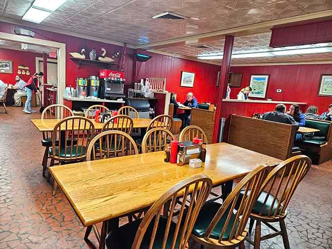 Red walls and wooden chairs mean business here, the kind of business that involves serious barbecue consumption.