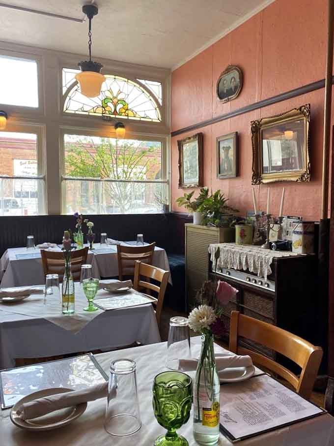 Peachy-pink walls and stained glass windows create an atmosphere that's part grandmother's parlor, part sophisticated supper club, all wonderful.