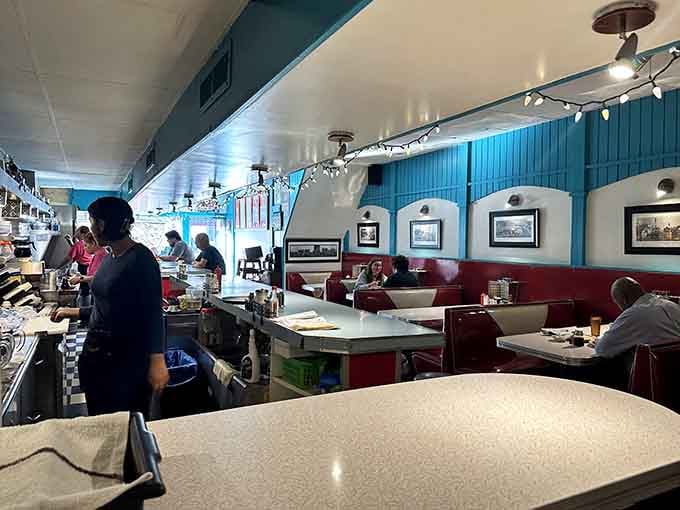 Red vinyl booths, checkered floors, and vintage memorabilia create an authentic 1950s atmosphere worth savoring slowly.
