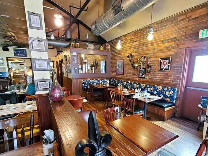 Exposed brick, warm wood, and cozy booths create the kind of breakfast atmosphere your grandmother would approve of wholeheartedly.