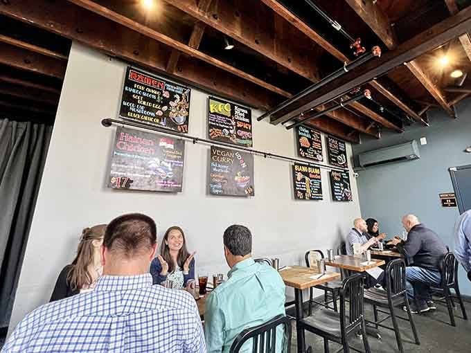 Industrial-chic meets neighborhood hangout where exposed beams and colorful menu boards set the delicious stage ahead.