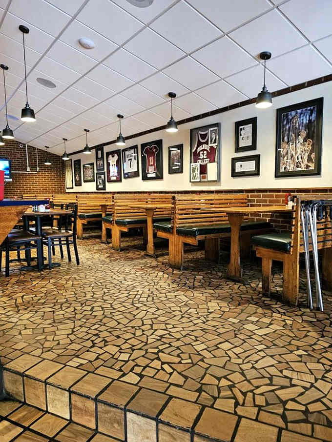 Sports memorabilia and cozy booths create the perfect setting for your epic battle with oversized Italian food.