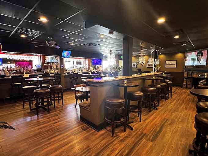 Dark wood floors and a curved bar create the kind of tavern atmosphere where everybody feels like a regular.