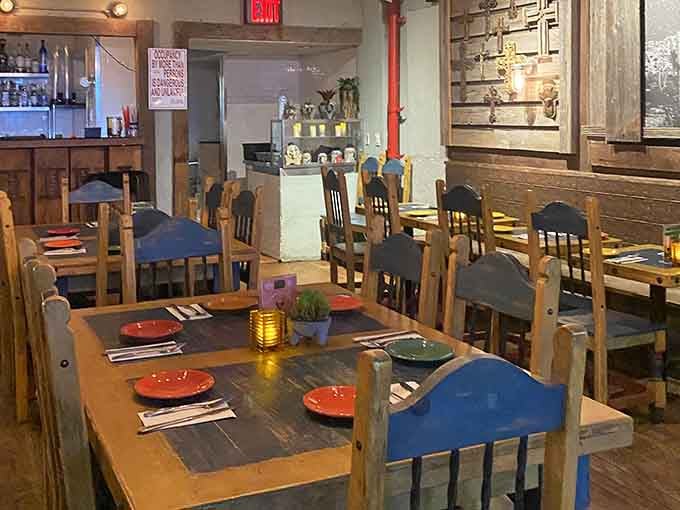 Wooden tables and colorful chairs create the kind of welcoming vibe that makes strangers become friends.