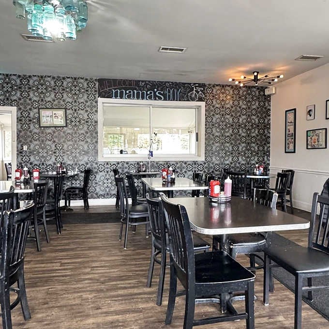 Patterned wallpaper meets modern simplicity in a dining room that feels like your stylish friend's kitchen.