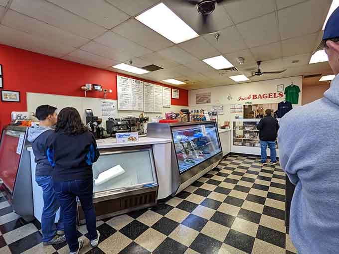 The checkered floor and red walls create a classic deli vibe that feels both timeless and welcoming.