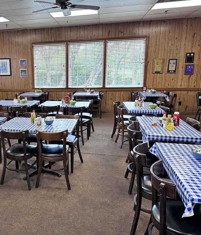Wood paneling and blue checkered tablecloths create the kind of cozy atmosphere where calories don't count and seconds are practically mandatory.