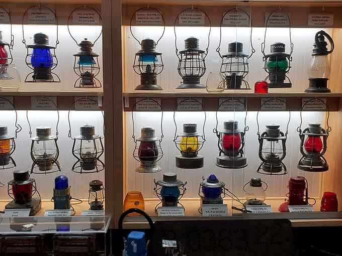 These colorful railroad lanterns once guided trains through the darkness, now they're guiding you through history's glow.