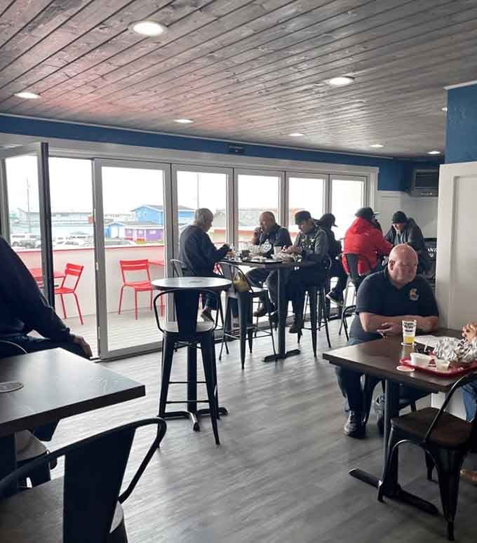 Floor-to-ceiling windows frame the marina views while you devour the freshest catch you've ever tasted.