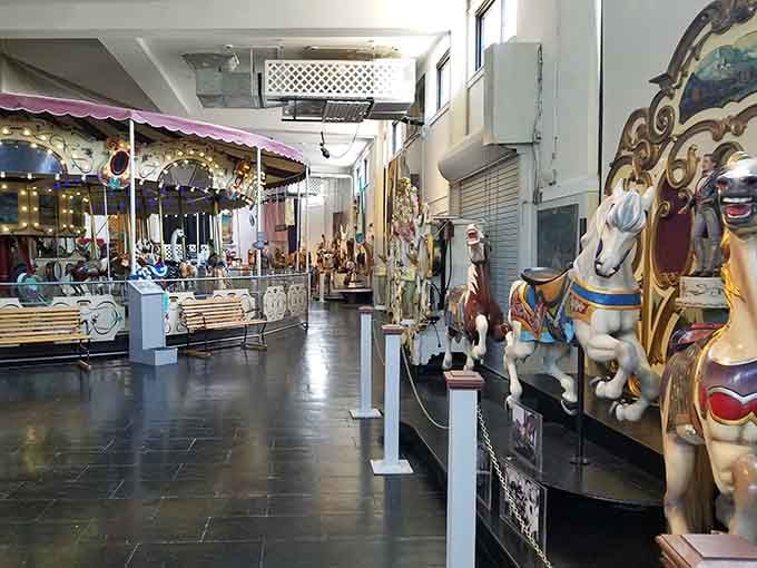A treasure trove of carousel history stretches before you like a wooden menagerie museum.