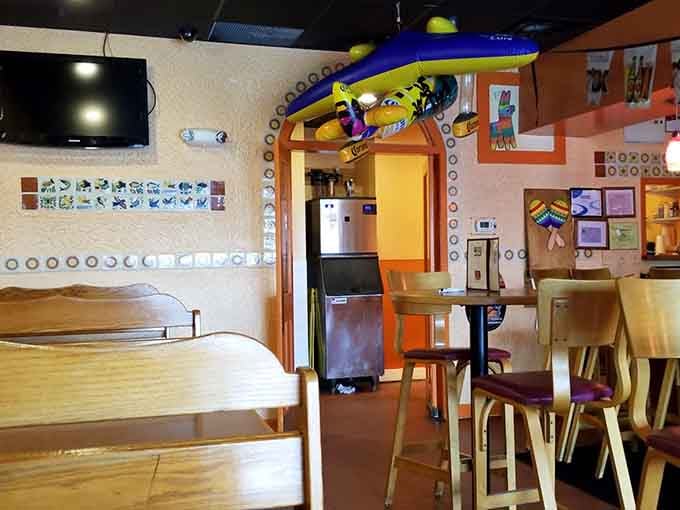 Colorful walls and festive vibes transport you straight to flavor country, no passport required for this delicious journey.