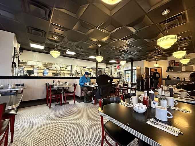 Red counter stools and vintage pendant lights create the perfect stage for your morning meal masterpiece.